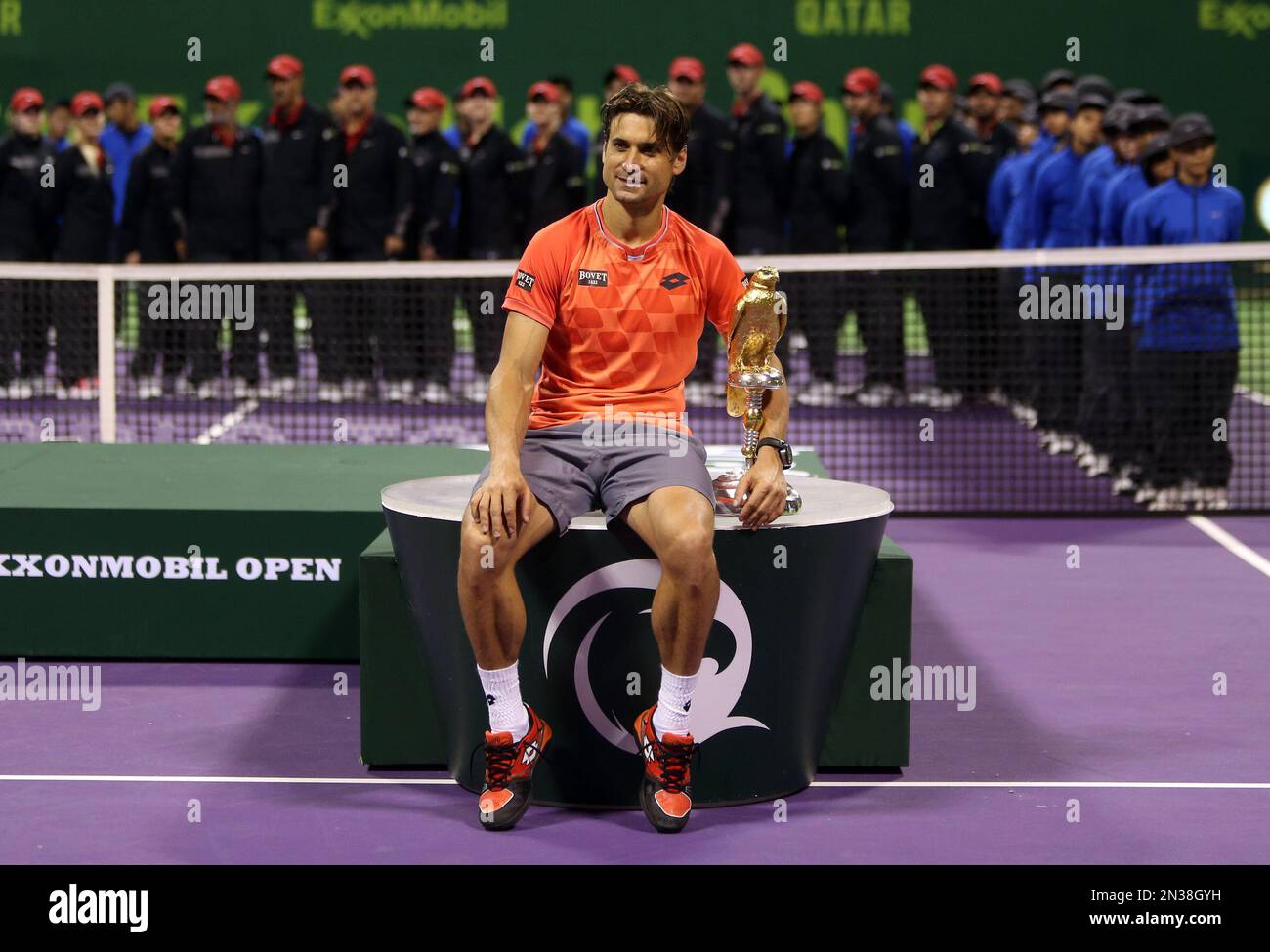 Spain's David Ferrer poses with his trophy after winning Qatar's ...