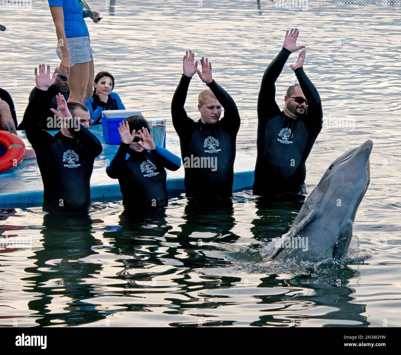 In this Friday, Jan. 9, 2015, photo armed forces vets give a signal to ...