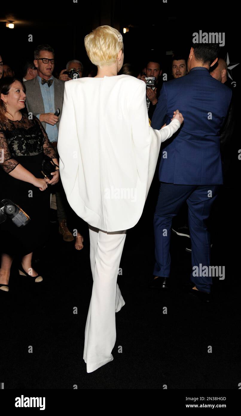 Event co-host Miley Cyrus arrives at the opening of W Magazine's ...