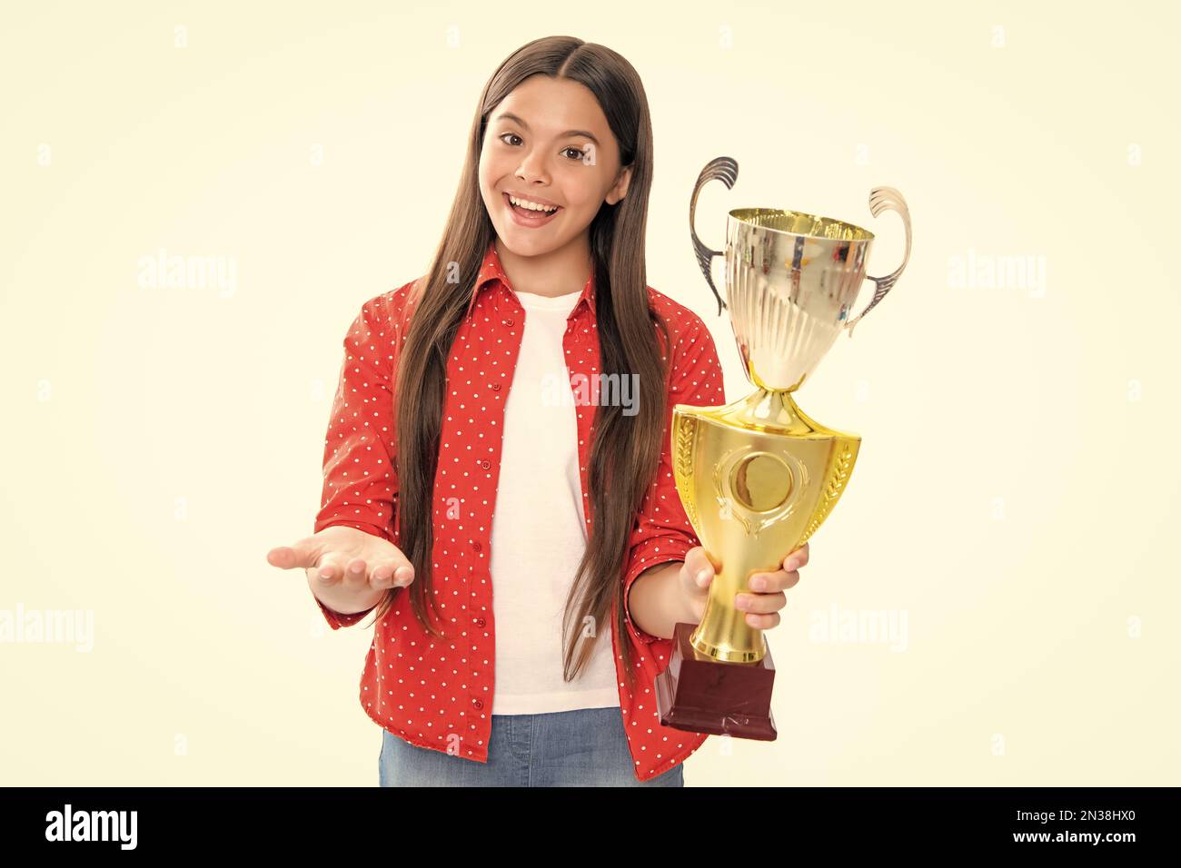 Teenage girl holding a trophy. Kid winner child won the competition ...