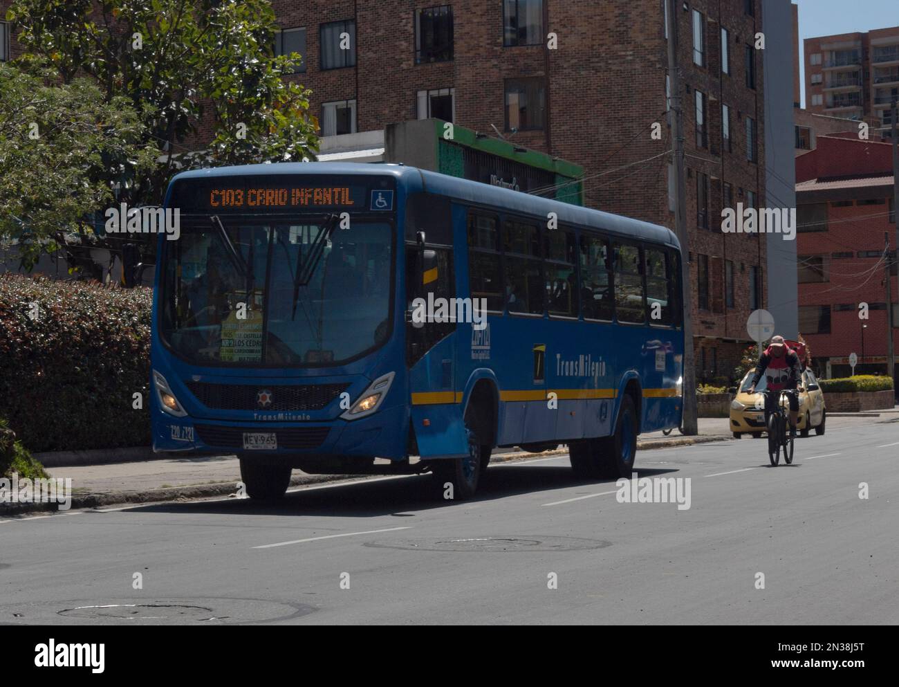 BOGOTA, COLOMBIA - A SITP blue bus near to a Cyclist during bogota no ...