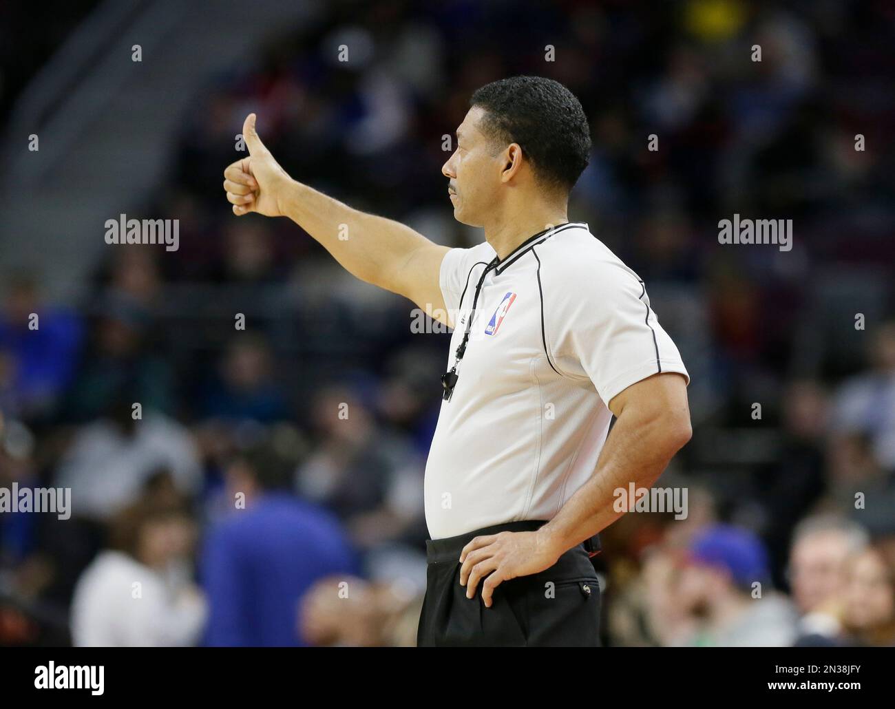 Referee James Williams signals during the second half of an NBA ...