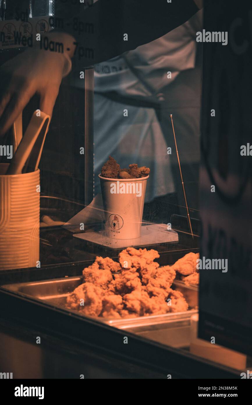 A vertical shot of the Korean fried chicken kokodak in a restaurant in ...