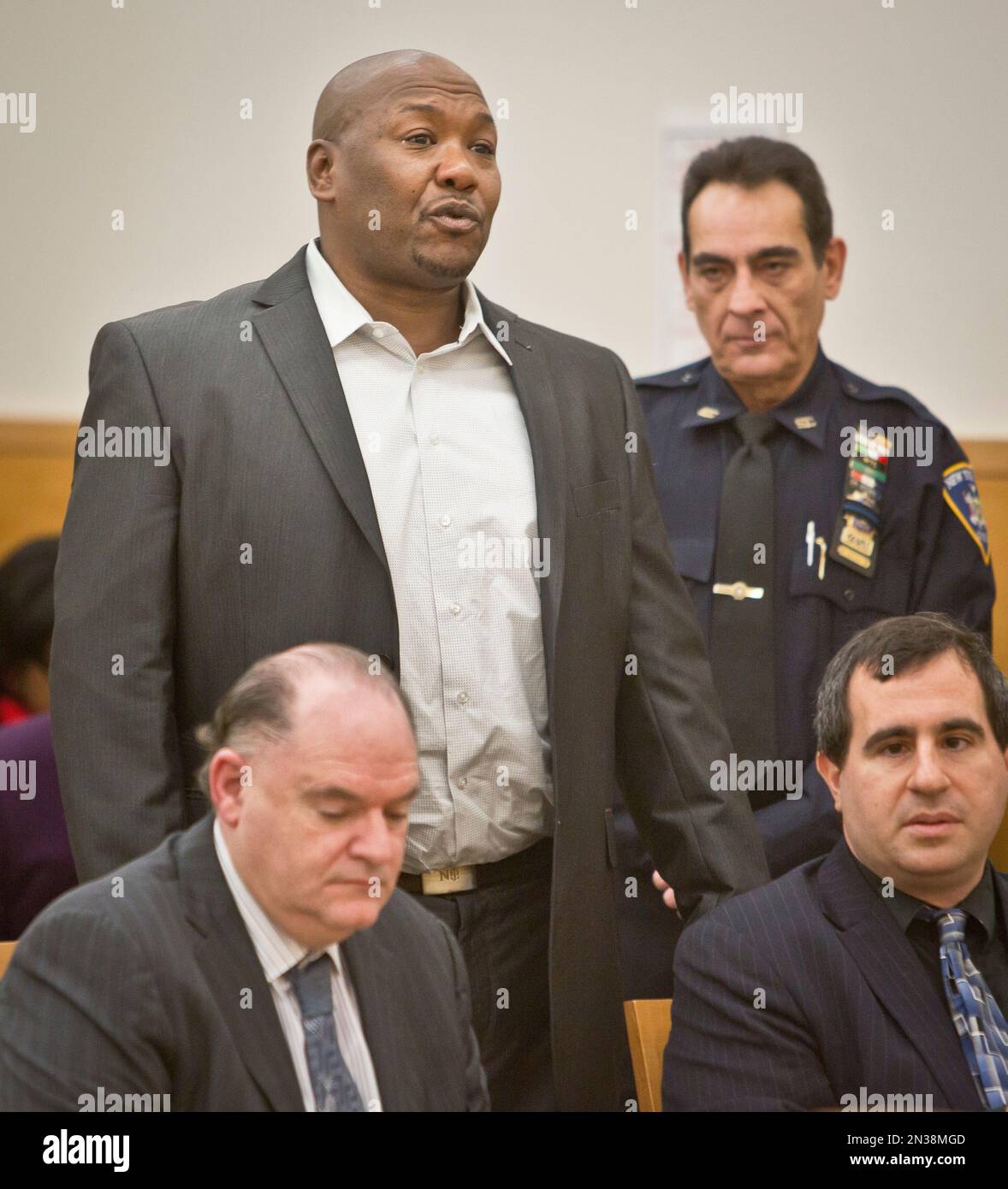 Derrick Hamilton, second from left, stands behind his lawyers Scott ...