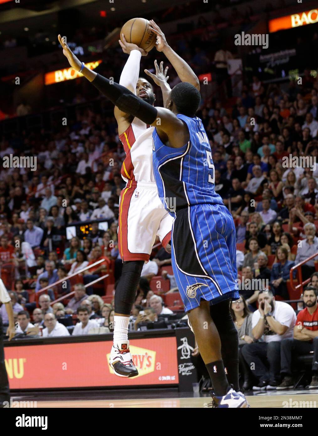 Orlando Magic guard Victor Oladipo (5) defends Miami Heat guard Dwyane ...