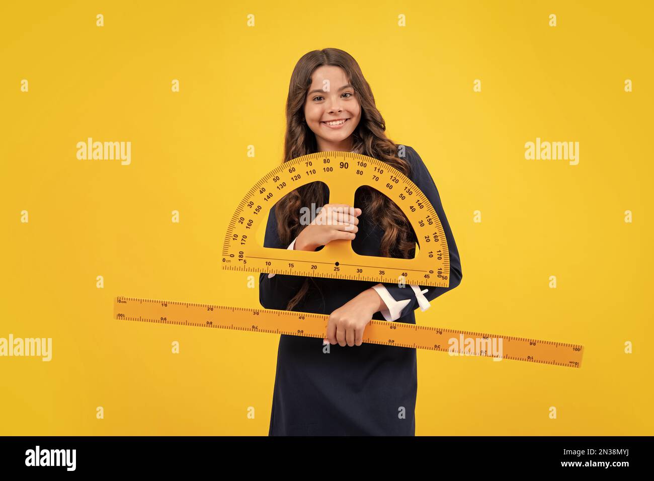 Teenager school girl study math or geometry lesson, measure the size ...