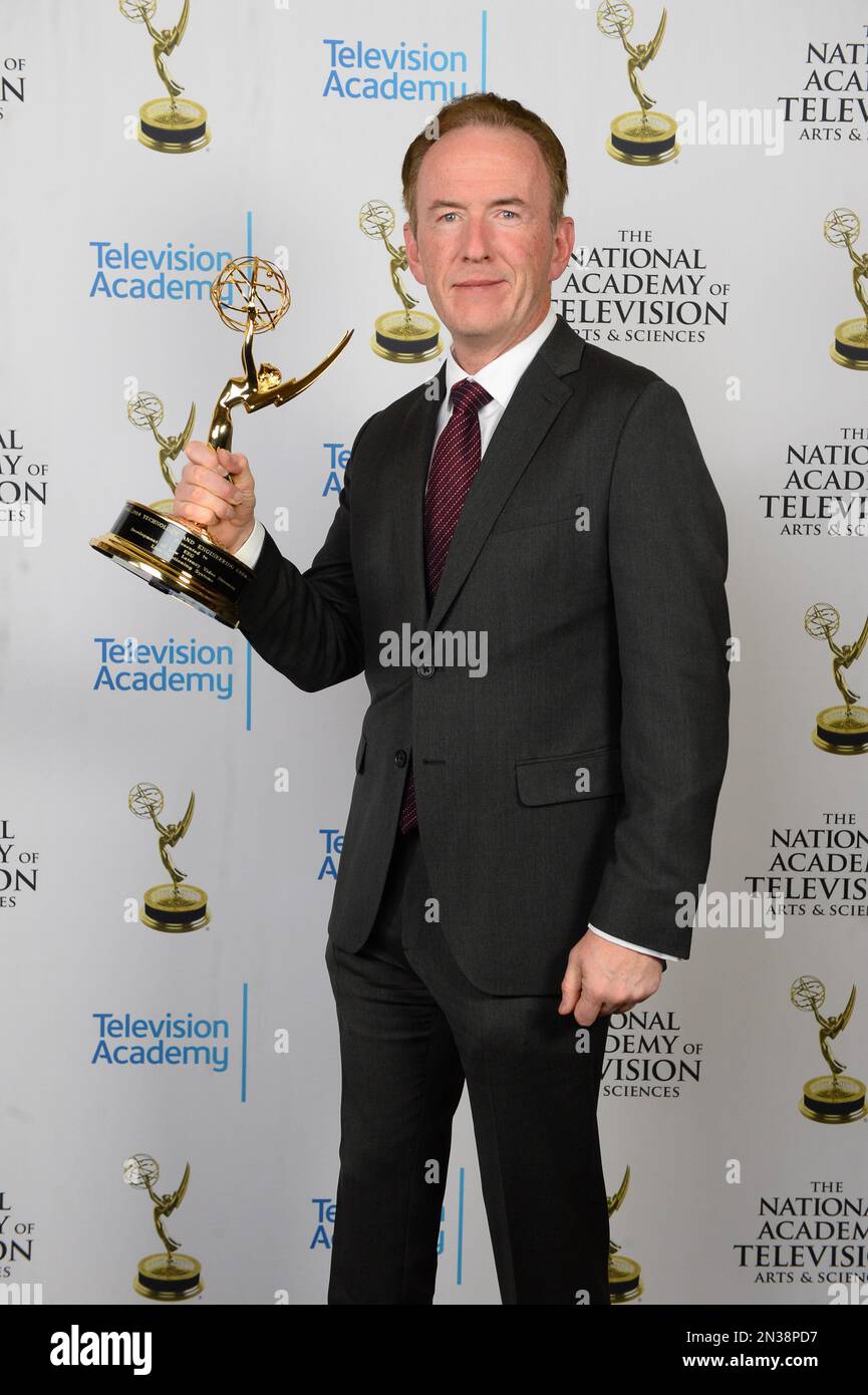 Tom McLaughlin of EEG poses backstage with the Emmy for Low Latency ...