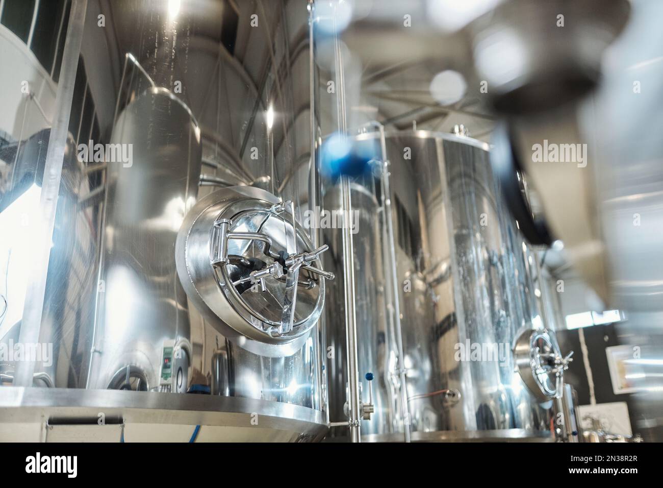 Background image of storage tanks and equipment at chemical factory ...