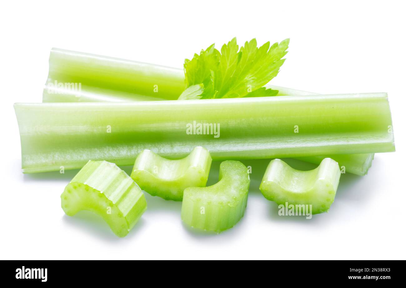 Pile of celery ribs and cuts isolated on white background Stock Photo - Alamy