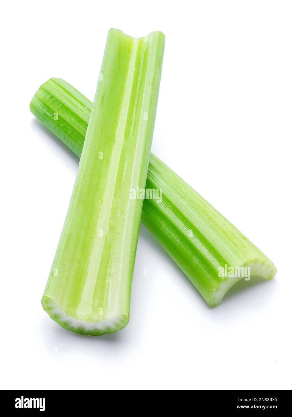Pile of celery ribs isolated on white background Stock Photo - Alamy
