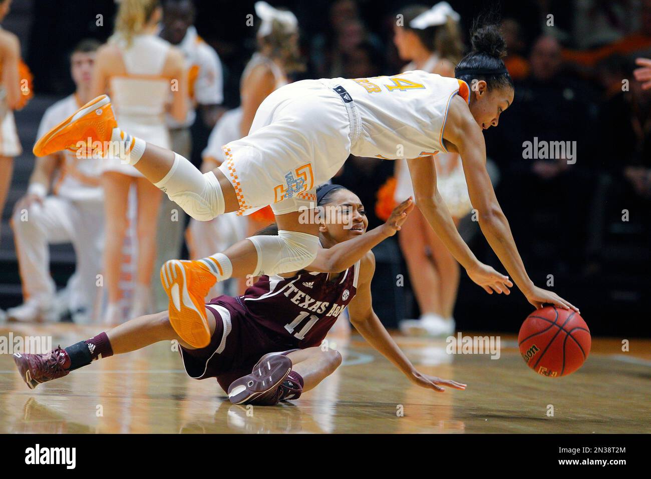 Tennessee guard Andraya Carter (14) leaps over Texas A&M guard Curtyce ...