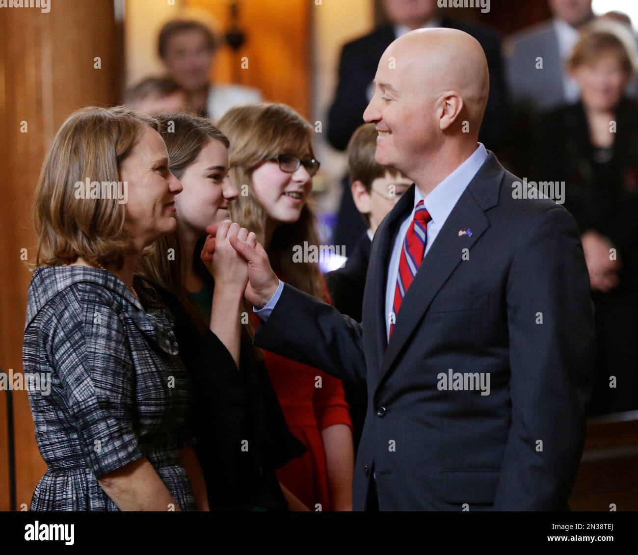 Gov. Pete Ricketts joins his wife Suzanne and their children after he ...