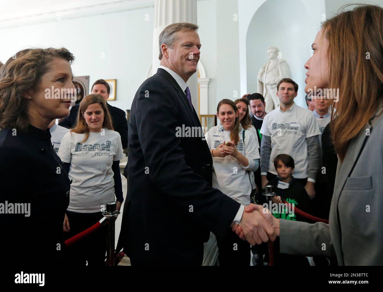 Charlie Baker, center, and his wife, Lauren, left, greet well-wishers ...