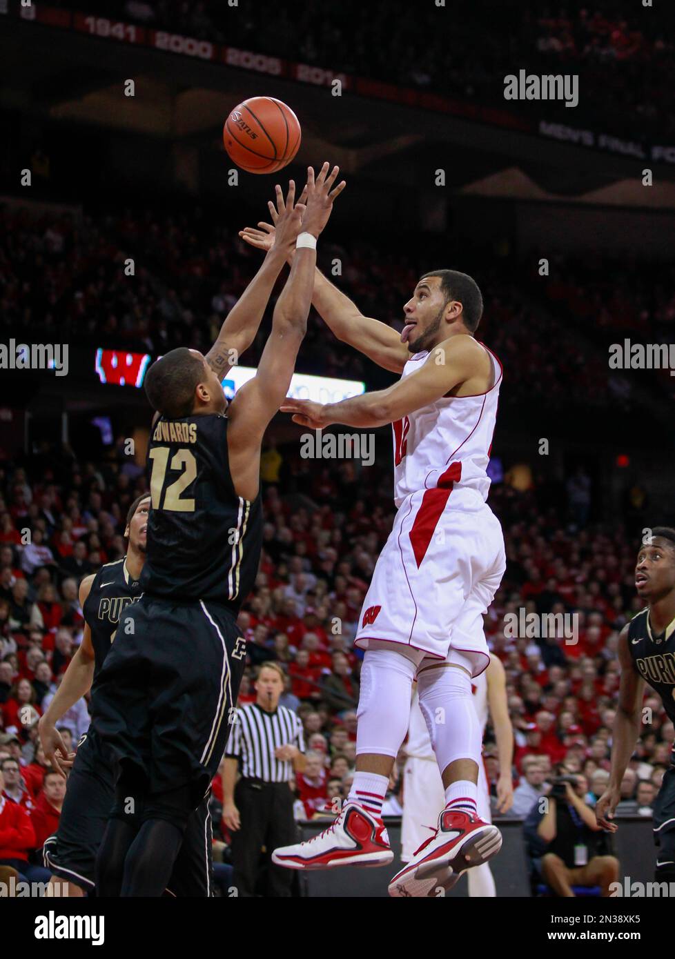 Wisconsin guard Traevon Jackson, right, against Purdue's A.J. Hammons ...
