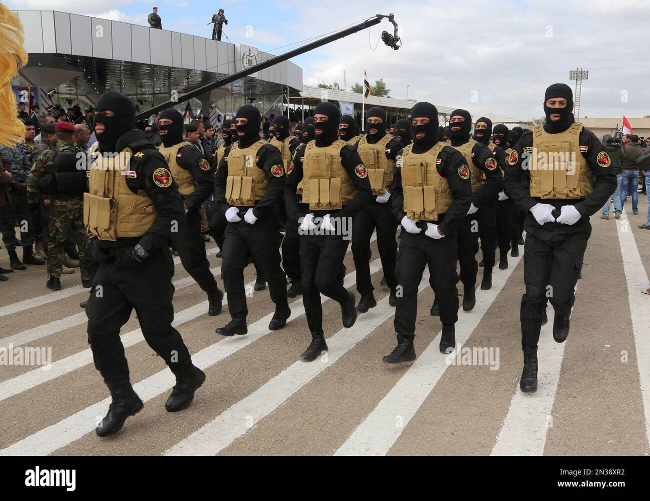 Iraqi police commandos march during a ceremony marking Police Day at ...