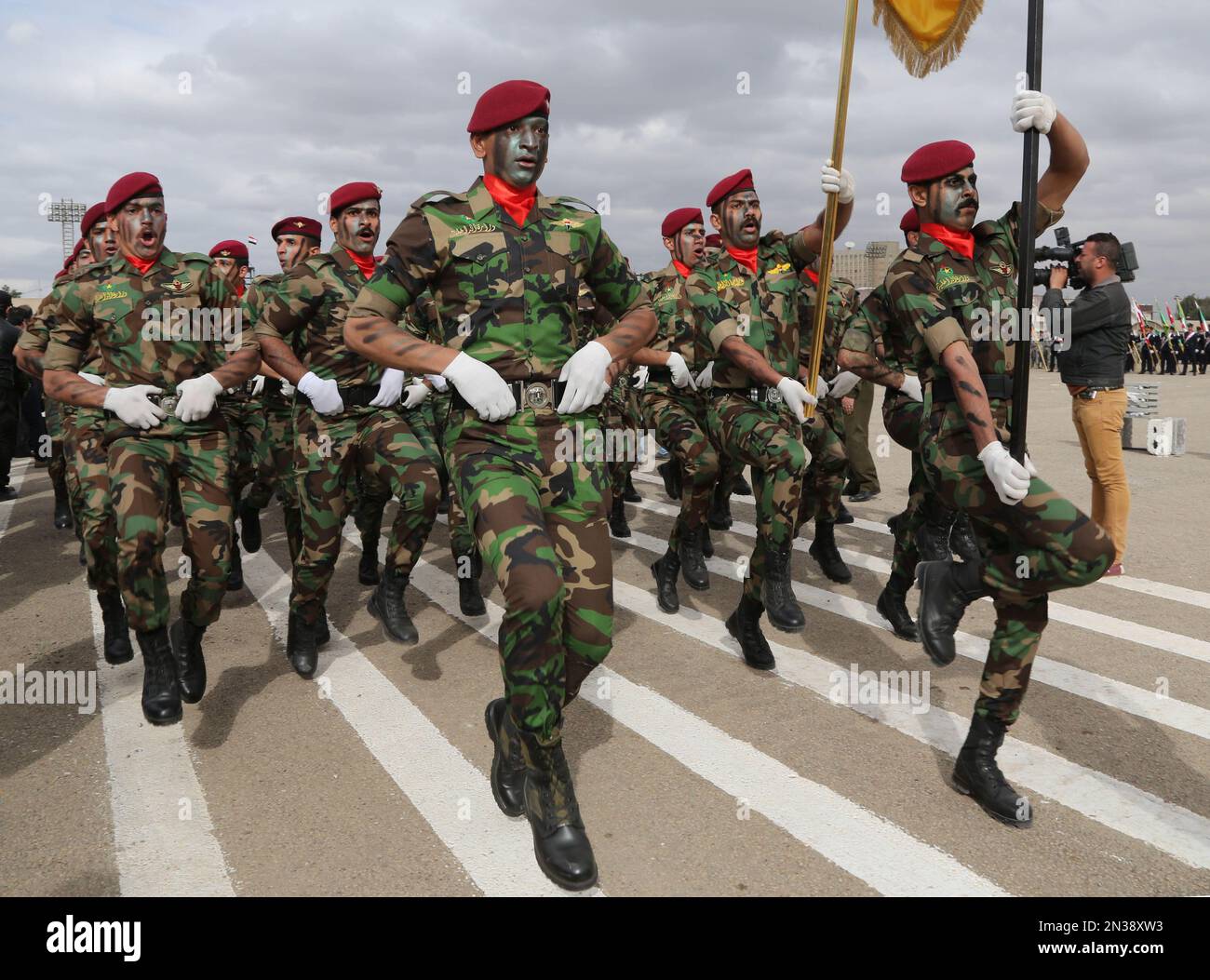 Iraqi police commandos march during a ceremony marking Police Day at ...