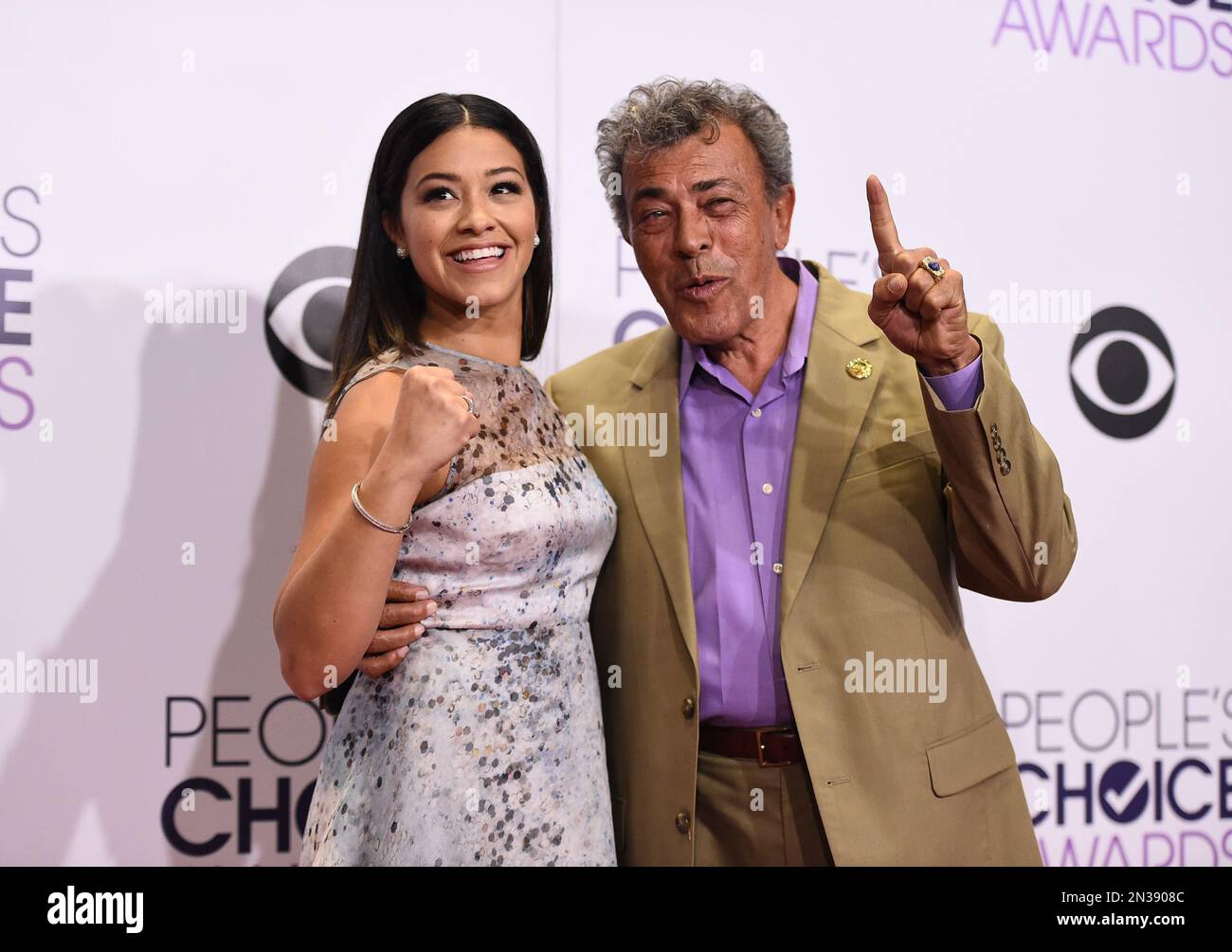 Gina Rodriguez, and Genaro Rodriguez pose in the press room at the ...