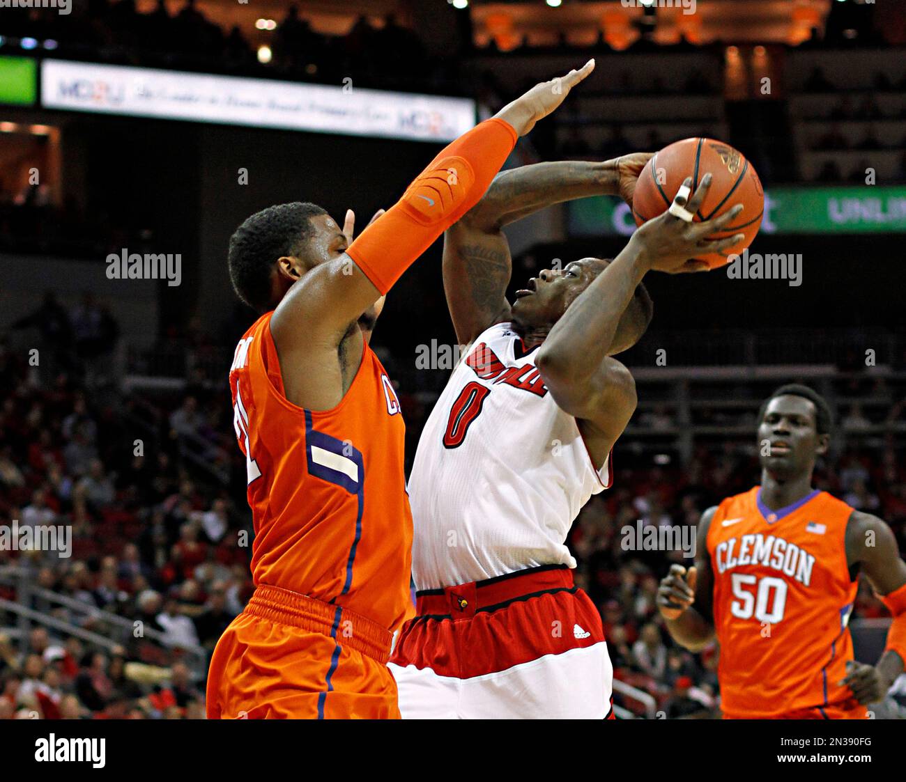 Louisville guard Terry Rozier (0) attempts a shot over the outstretched ...