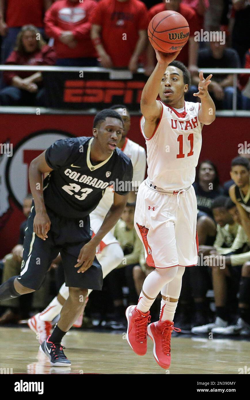 Utah guard Brandon Taylor (11) passes the ball as Colorado guard Jaron ...