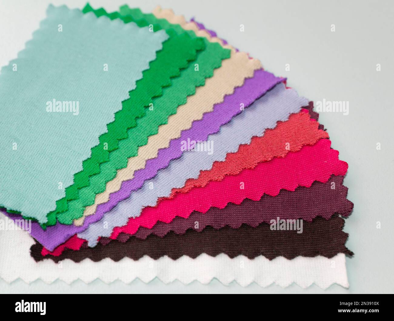 Macro fotography of a colorful cotton cloth samples over a white table ...