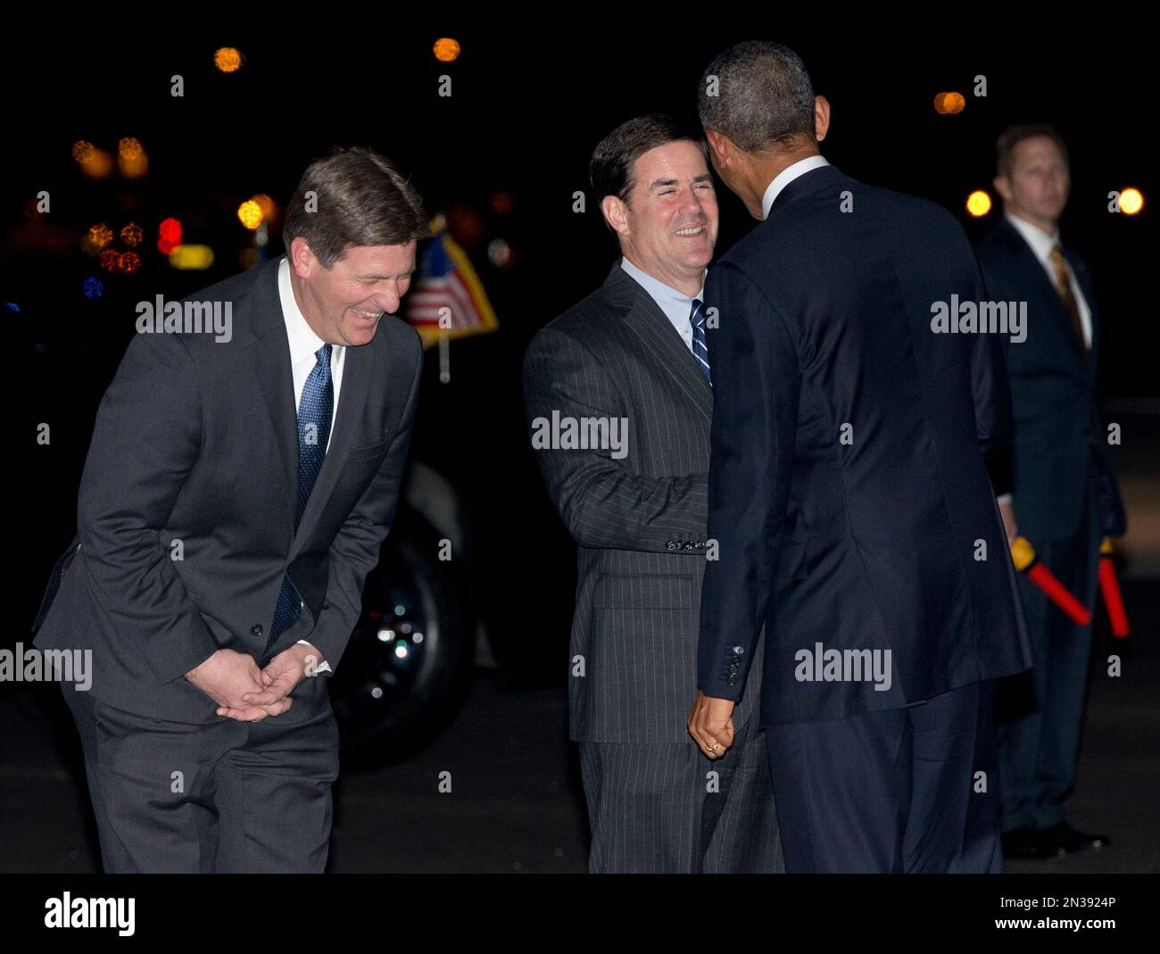 President Barack Obama is greeted by Republican Arizona Gov. Doug Ducey ...