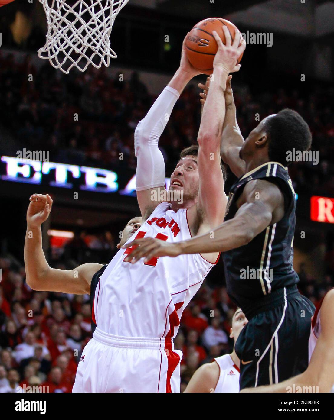 Wisconsin's Frank Kaminsky (44) pulls down a defensive rebound against ...