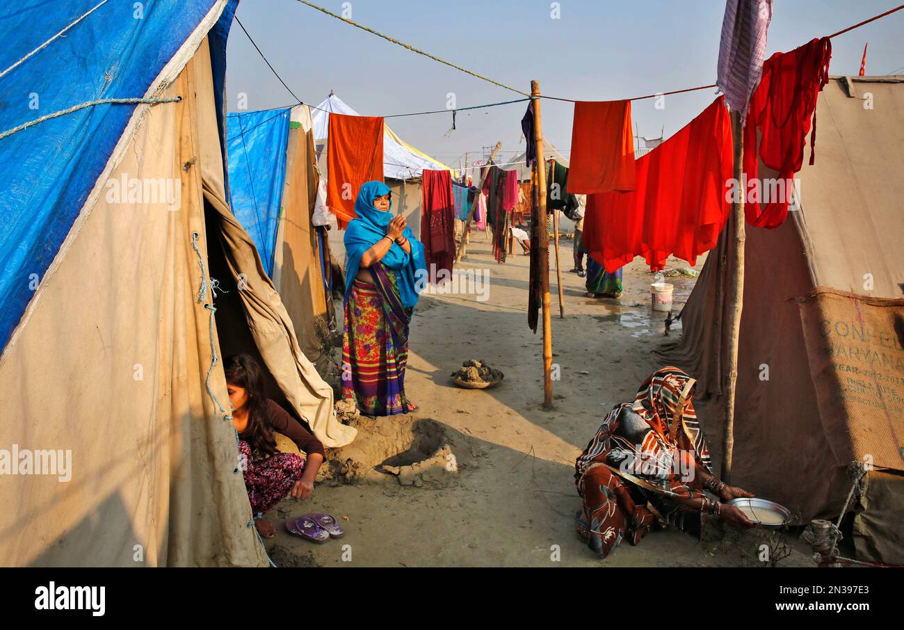 A Kalpavasi woman prays outside her rented tent at "Sangam", the ...