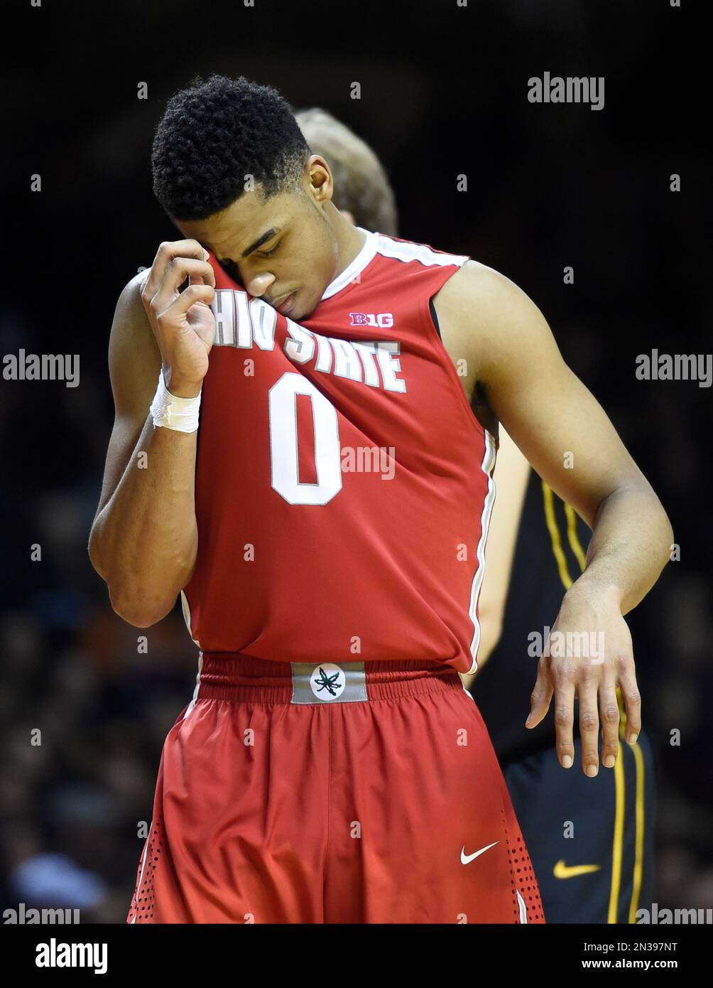 Ohio State guard D'Angelo Russell (0) wipes sweat off during overtime ...