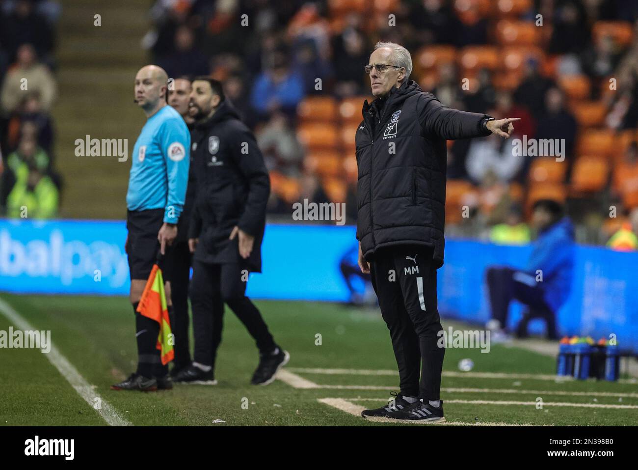 Mick McCarthy manager of Blackpool gives his team instructions during ...