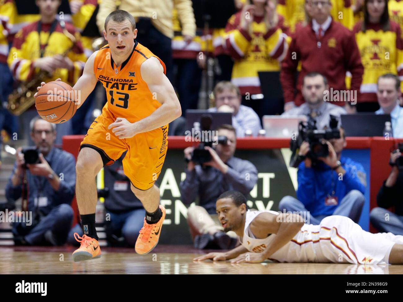 Oklahoma State guard Phil Forte III, left, drives up court as Iowa ...