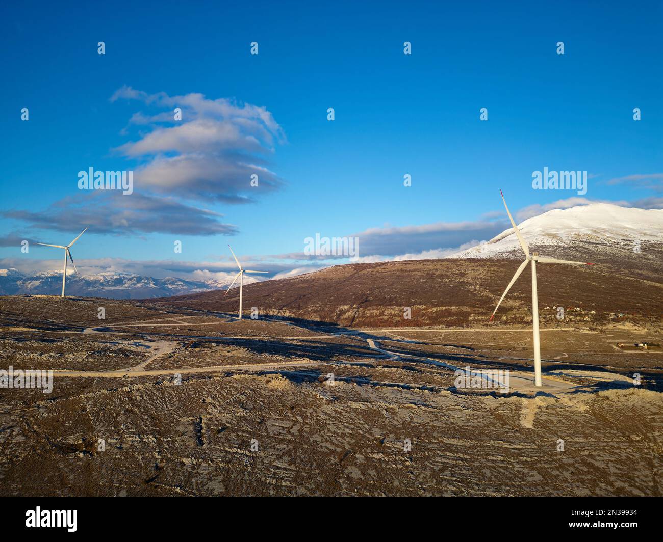 Windmills on the hills during sunset. Renewable energy, green energy ...