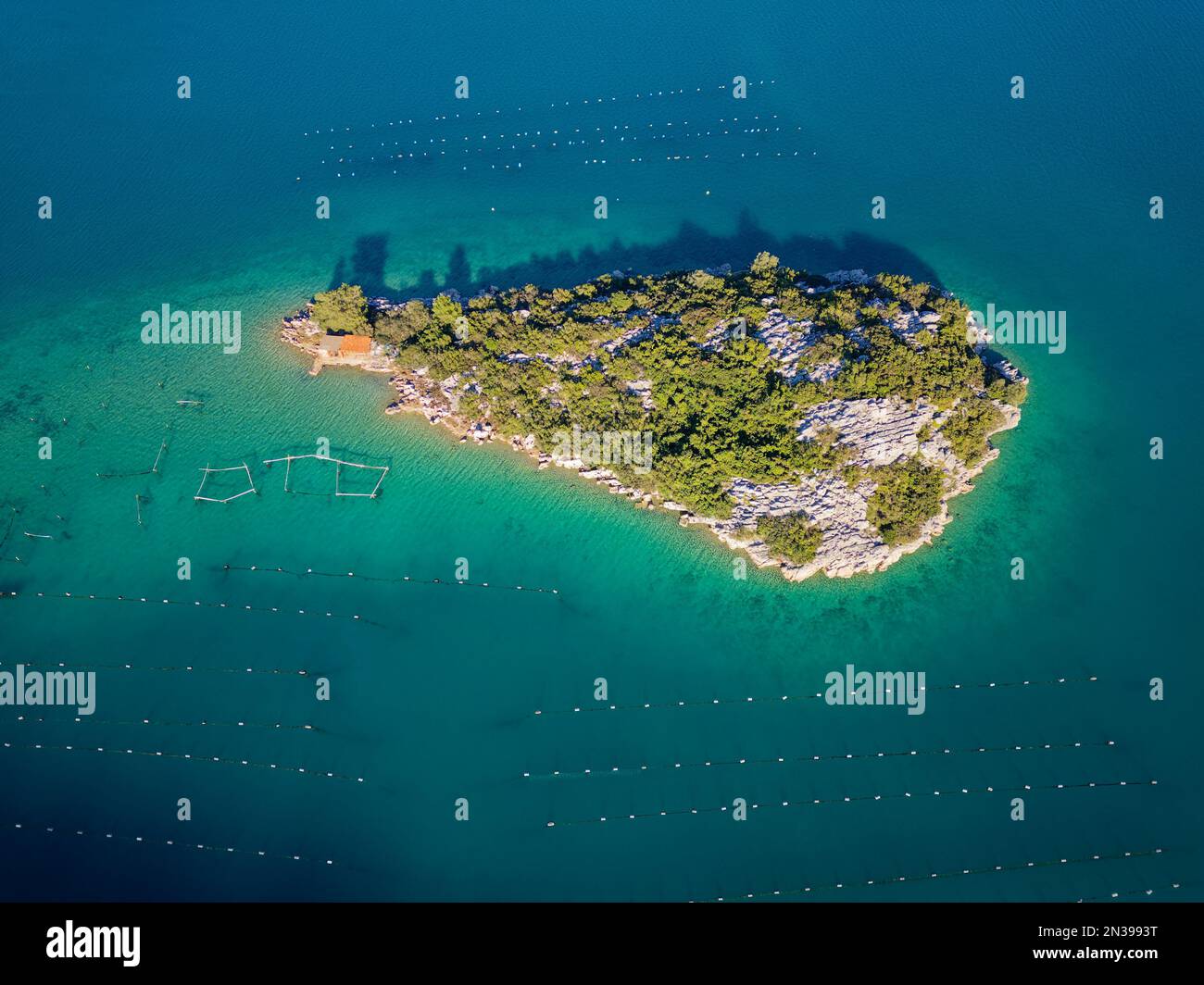 Aerial drone view of a small island in the bay of Mali Ston located on ...