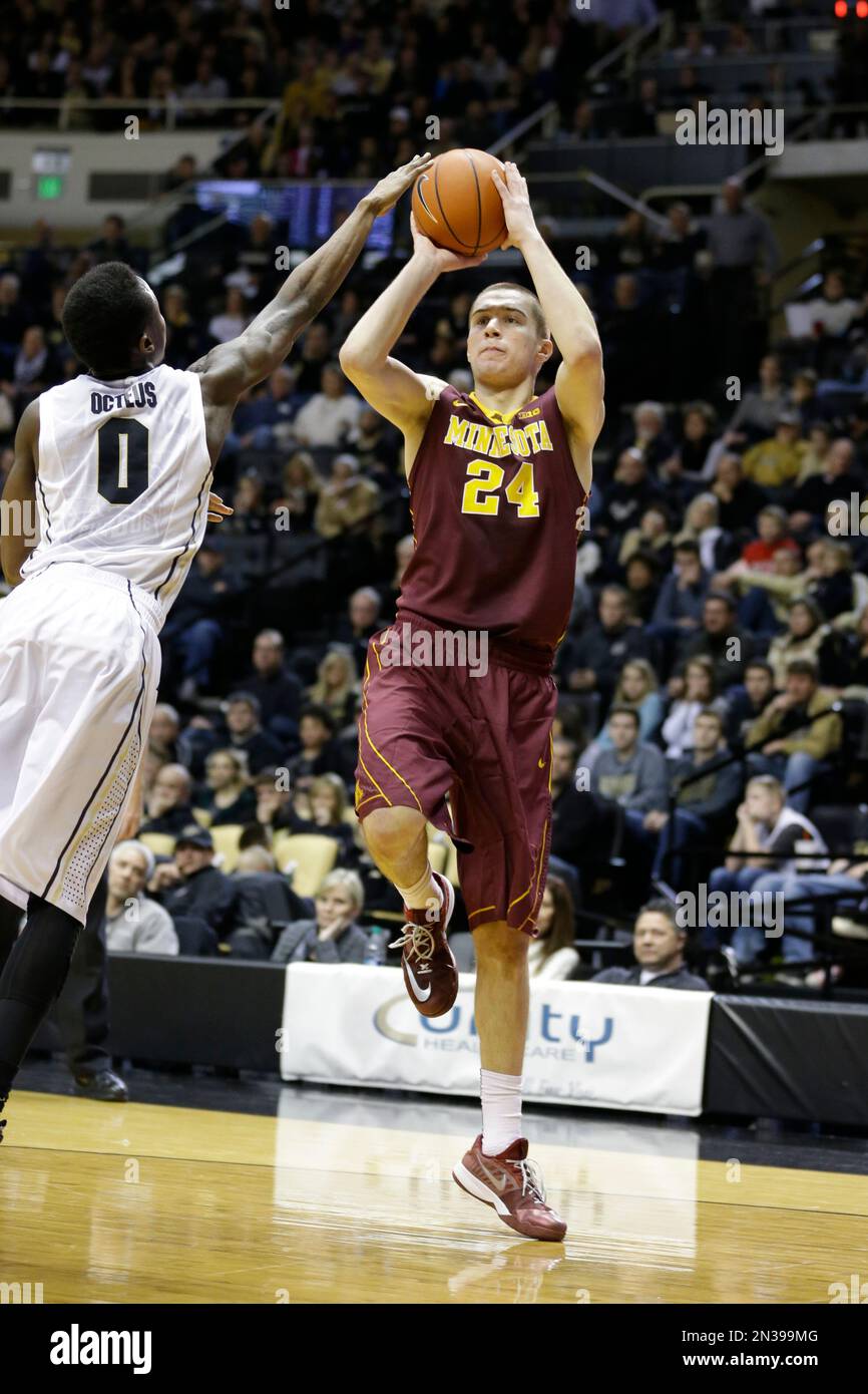 Minnesota forward Joey King (24) shoots over Purdue guard Jon Octeus (0 ...