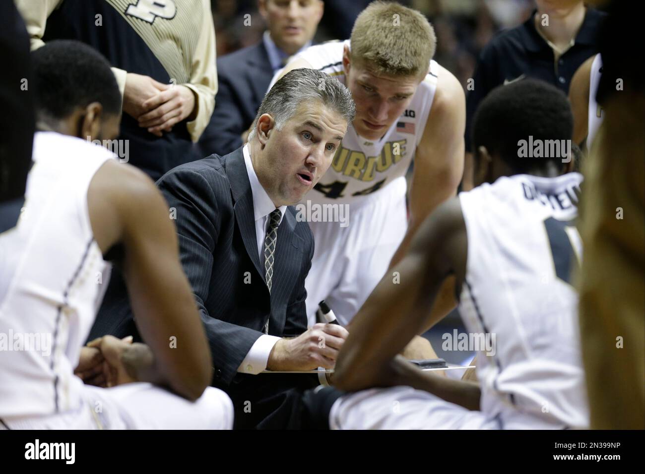 Purdue head coach Matt Painter talks to his players int he huddle in ...