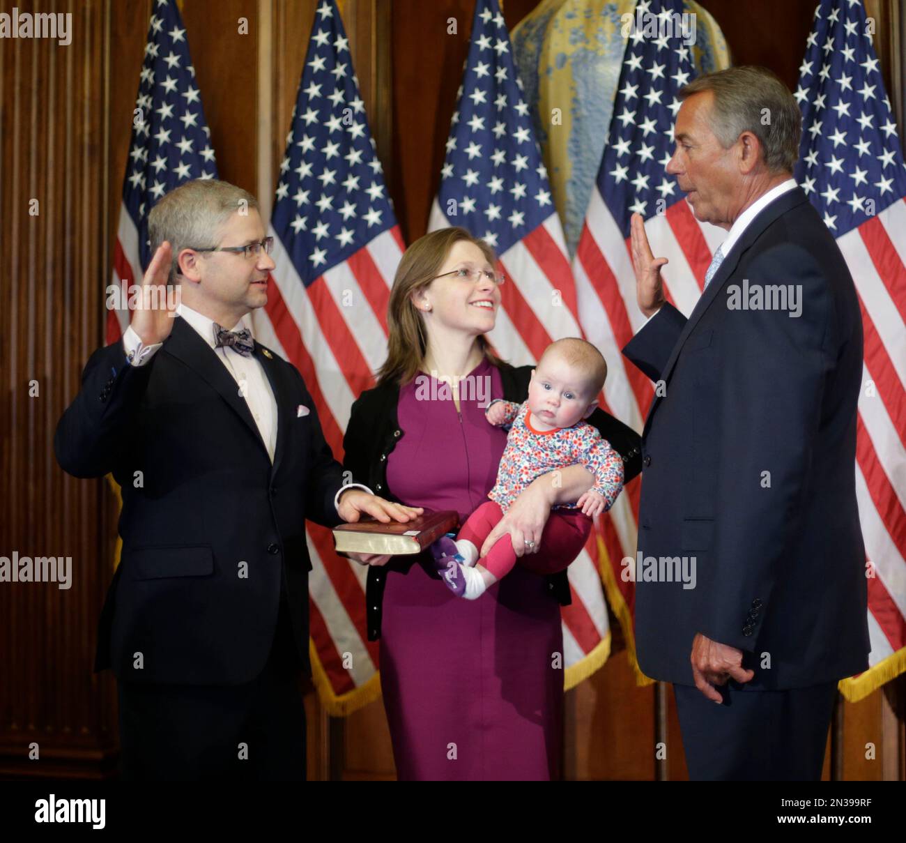 House Speaker John Boehner of Ohio administers the House oath to Rep ...