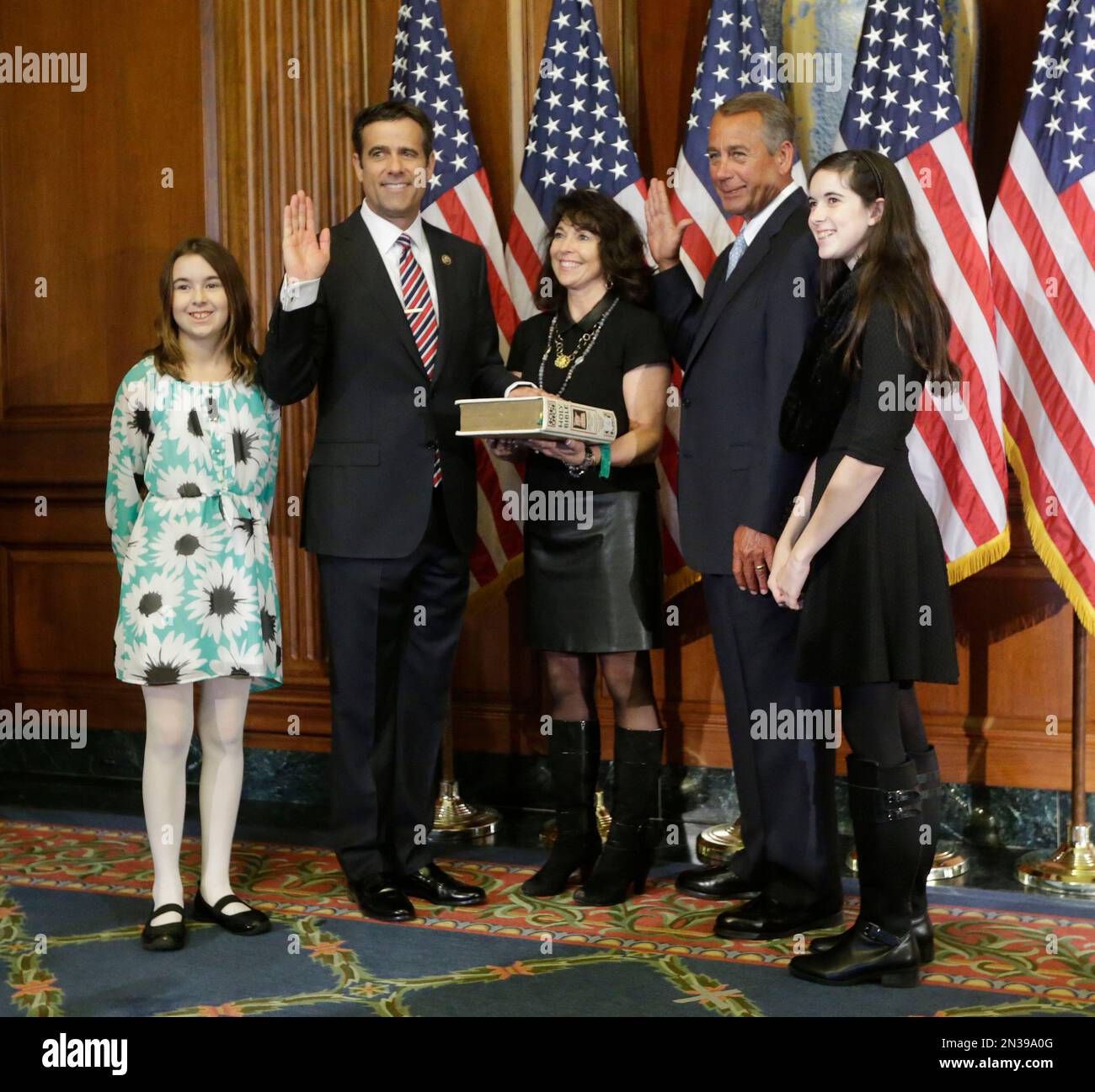 House Speaker John Boehner of Ohio administers the House oath to Rep ...