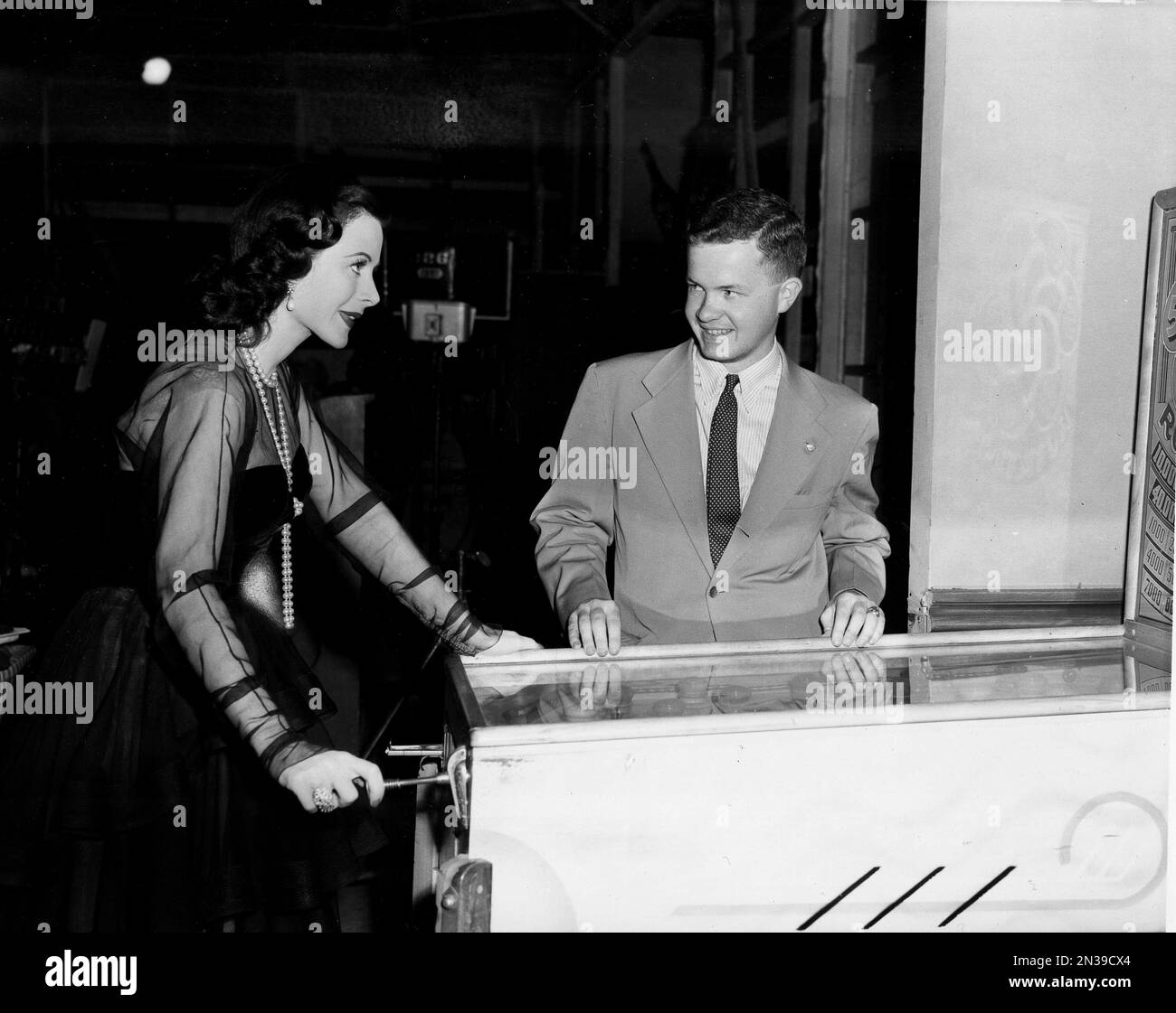 AP journalist Bob Thomas and Hedy Lamarr shooting pinball in Los ...
