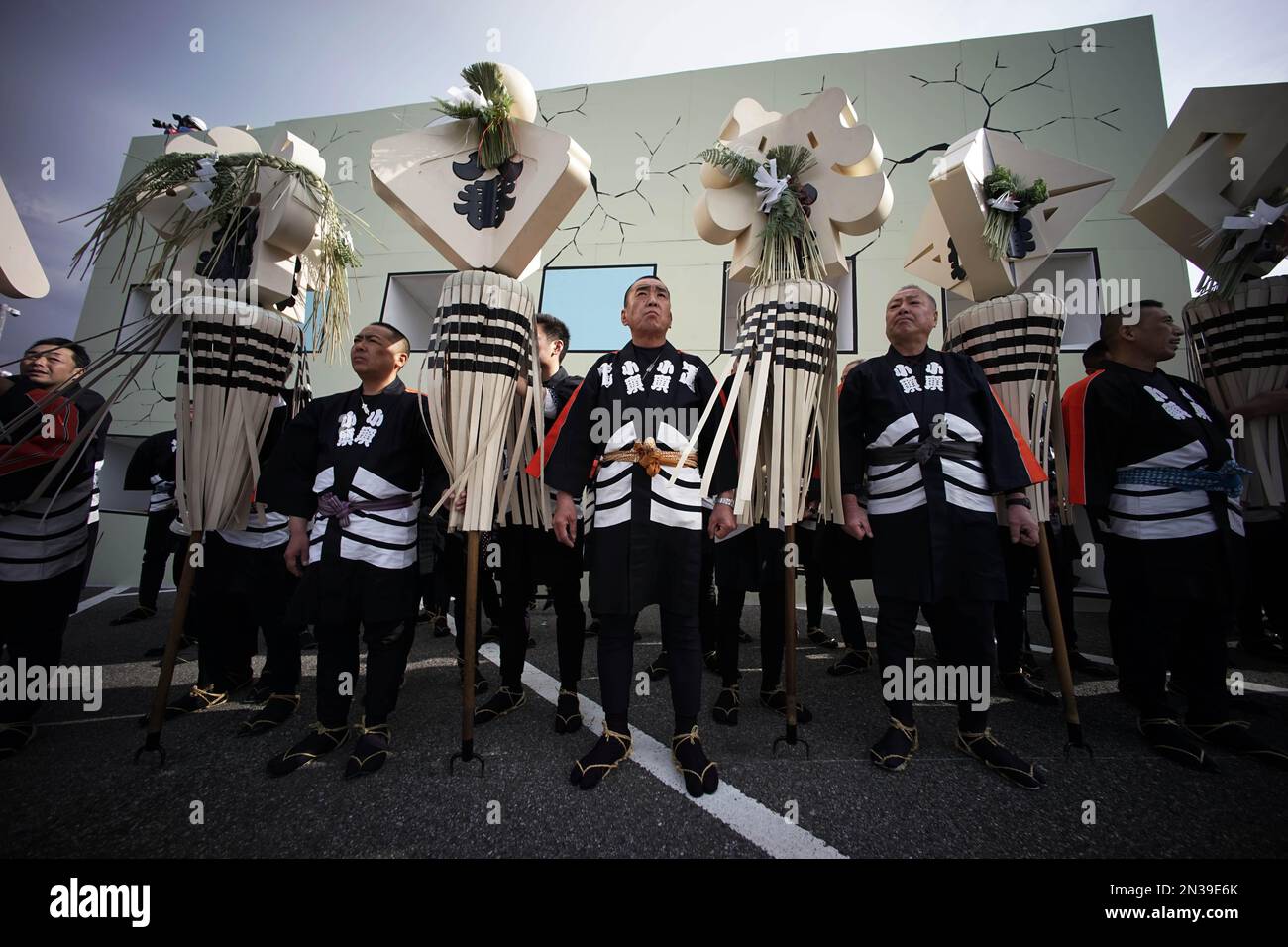Members of a traditional firefighting preservation group wait to ...