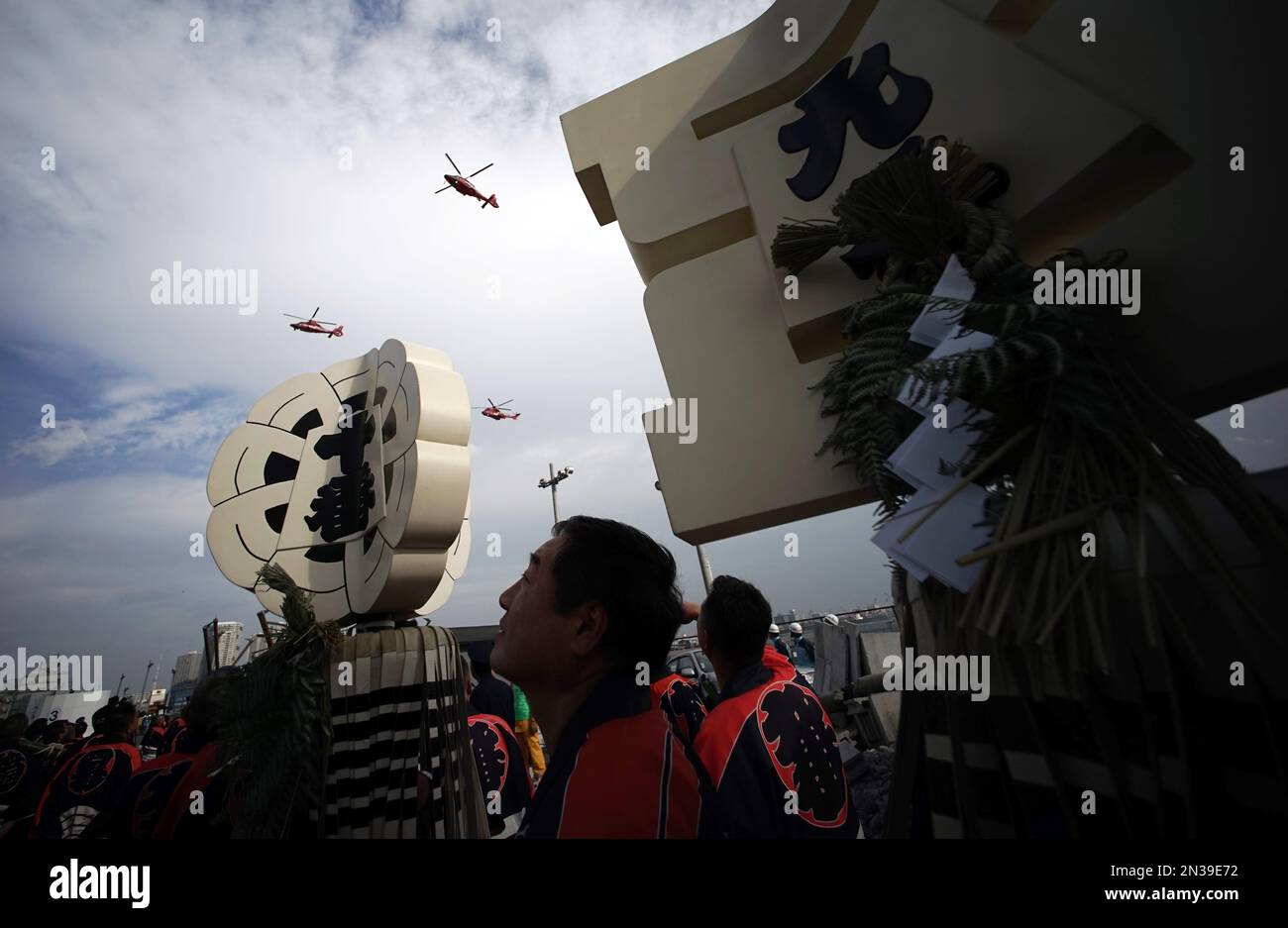 Members of a traditional firefighting preservation group wait to ...