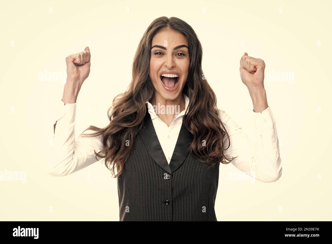 Cheerful beautiful young woman showing winner gesture. Girl celebrating ...