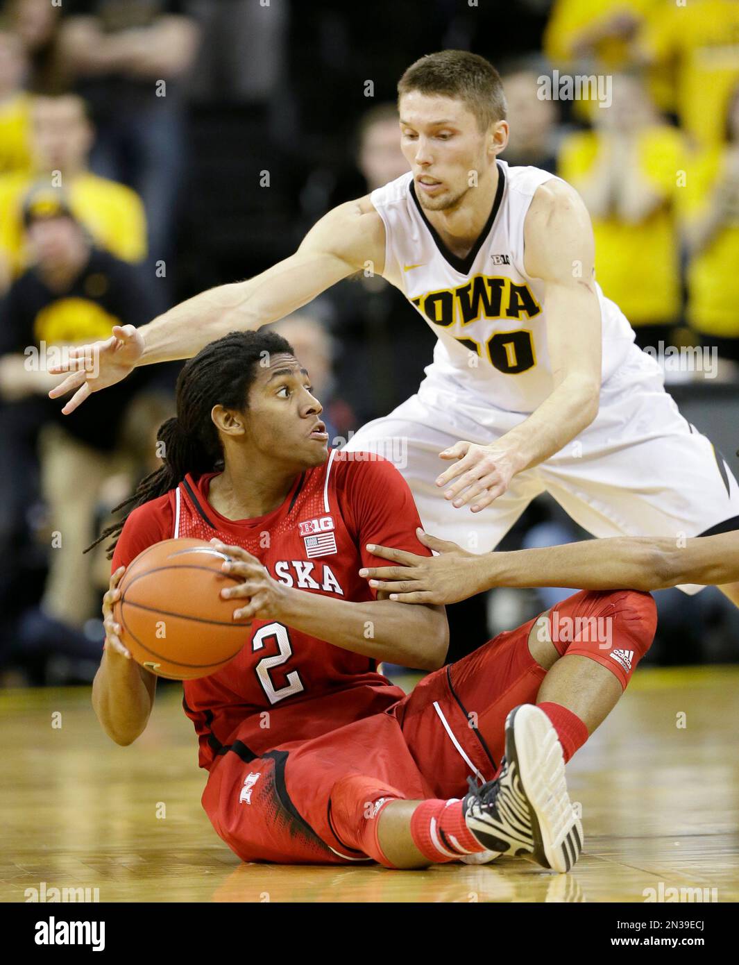 Nebraska forward David Rivers, left, grabs a loose ball in front of ...