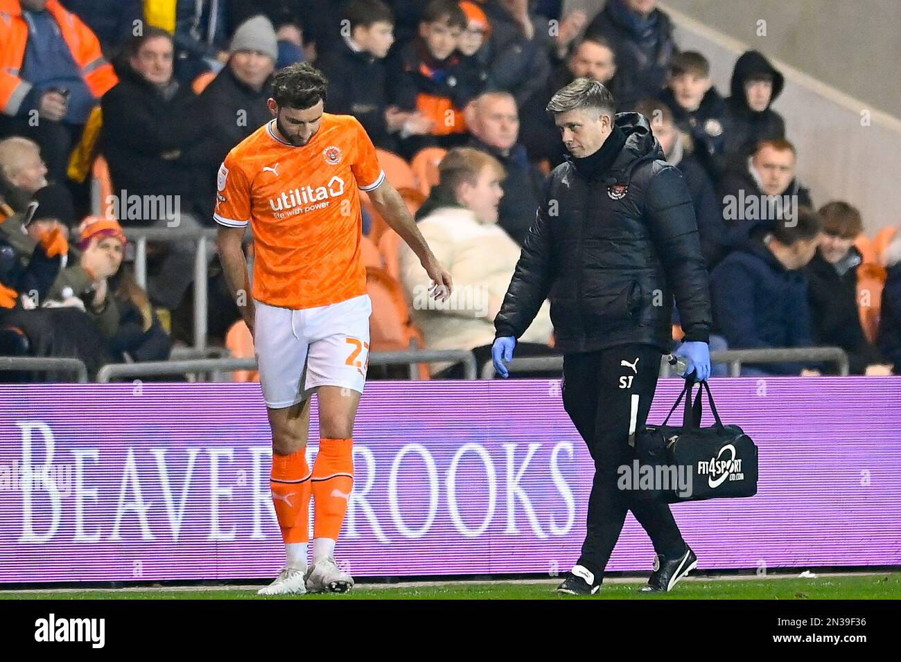 Charlie Goode #27 of Blackpool goes off injured during the Sky Bet ...