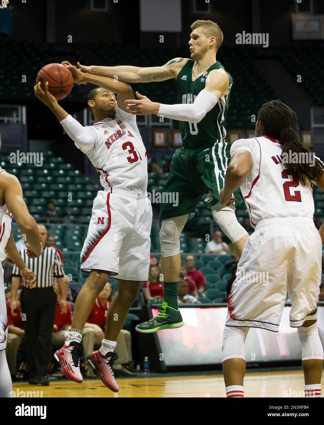 Nebraska guard Shavon Shields, left, controls a rebound as Ohio forward ...