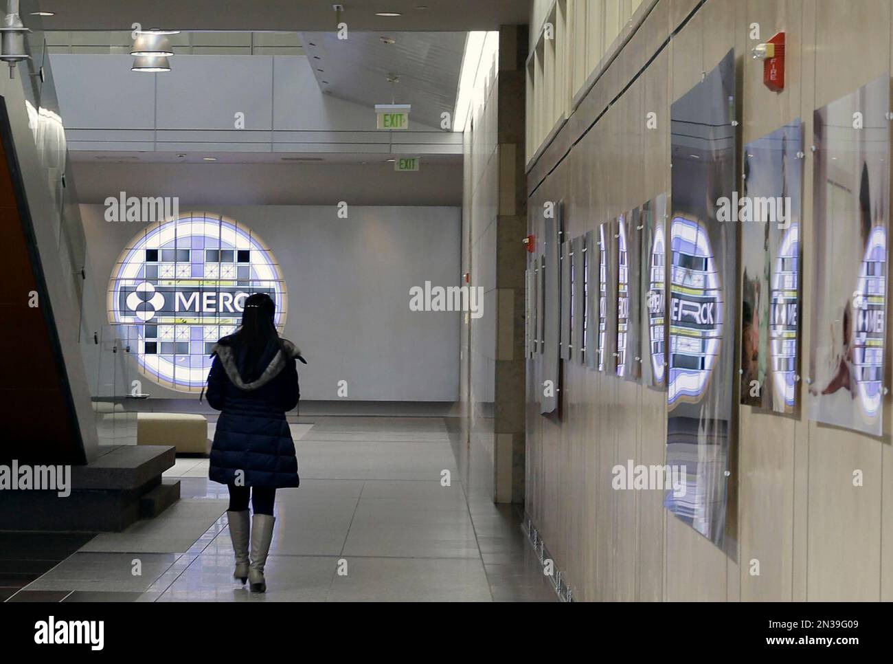 In this Thursday, Dec.18, 2014 photograph, the Merck logo is seen on a stained glass panel at a ...