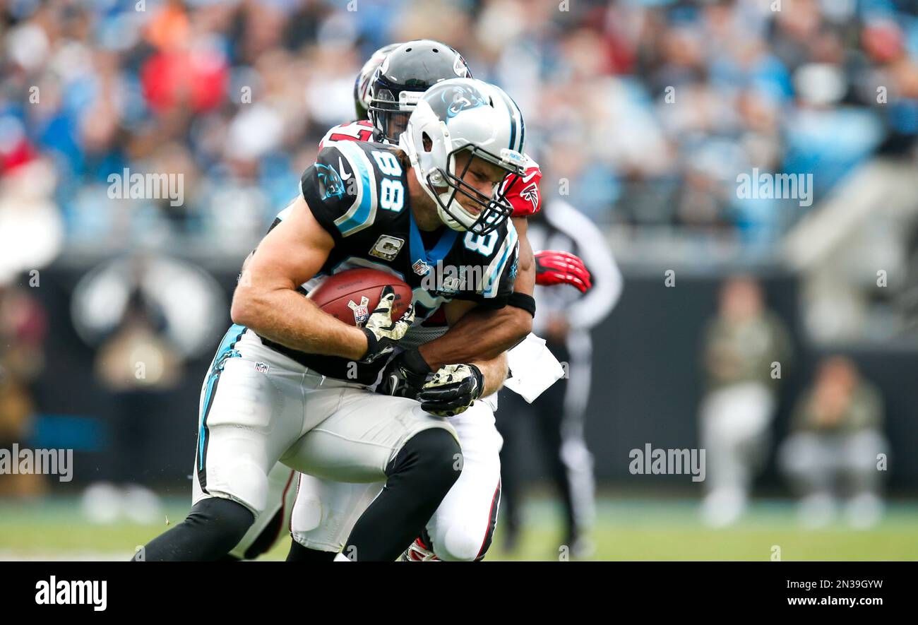 Carolina Panthers tight end Greg Olsen (88) is tackled by Atlanta Falcons cornerback Robert ...