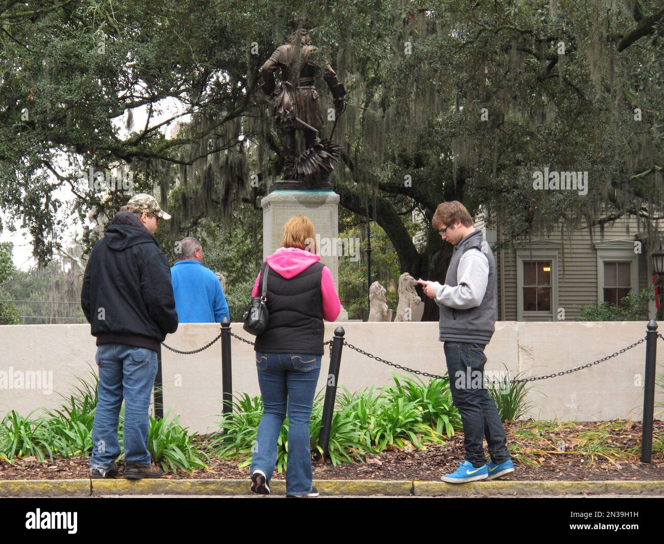 Passersby stop on the edge of Chippewa Square in Savannah, Georgia, on ...