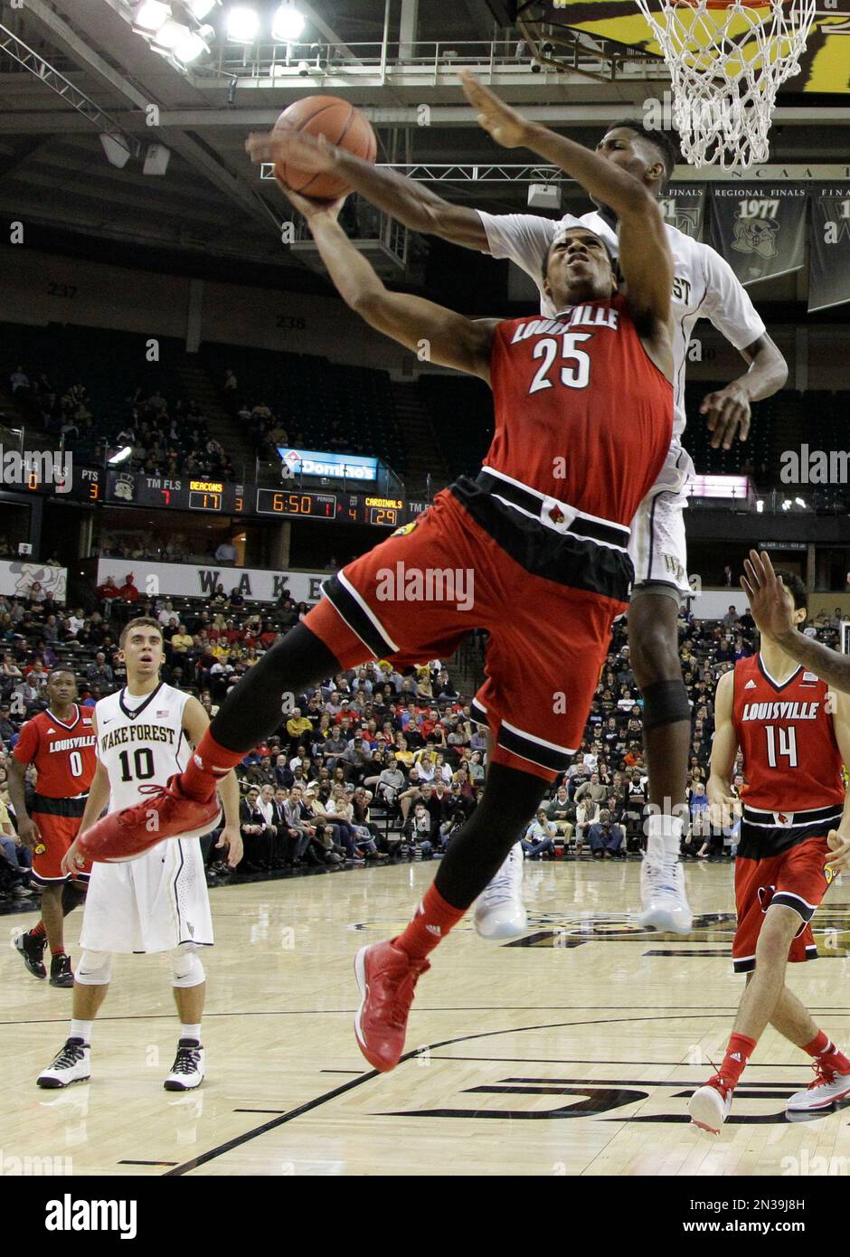 Louisville's Wayne Blackshear (25) is fouled by Wake Forest's Darius ...