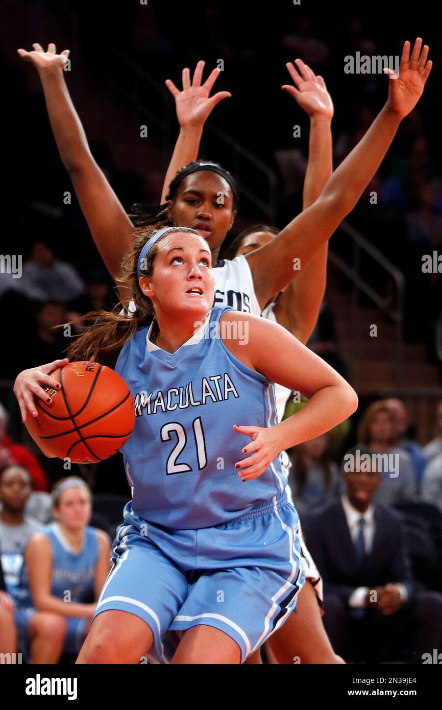 Immaculata's Reilly Larkin (21) looks to shoot ahead of Queens' Janeen ...