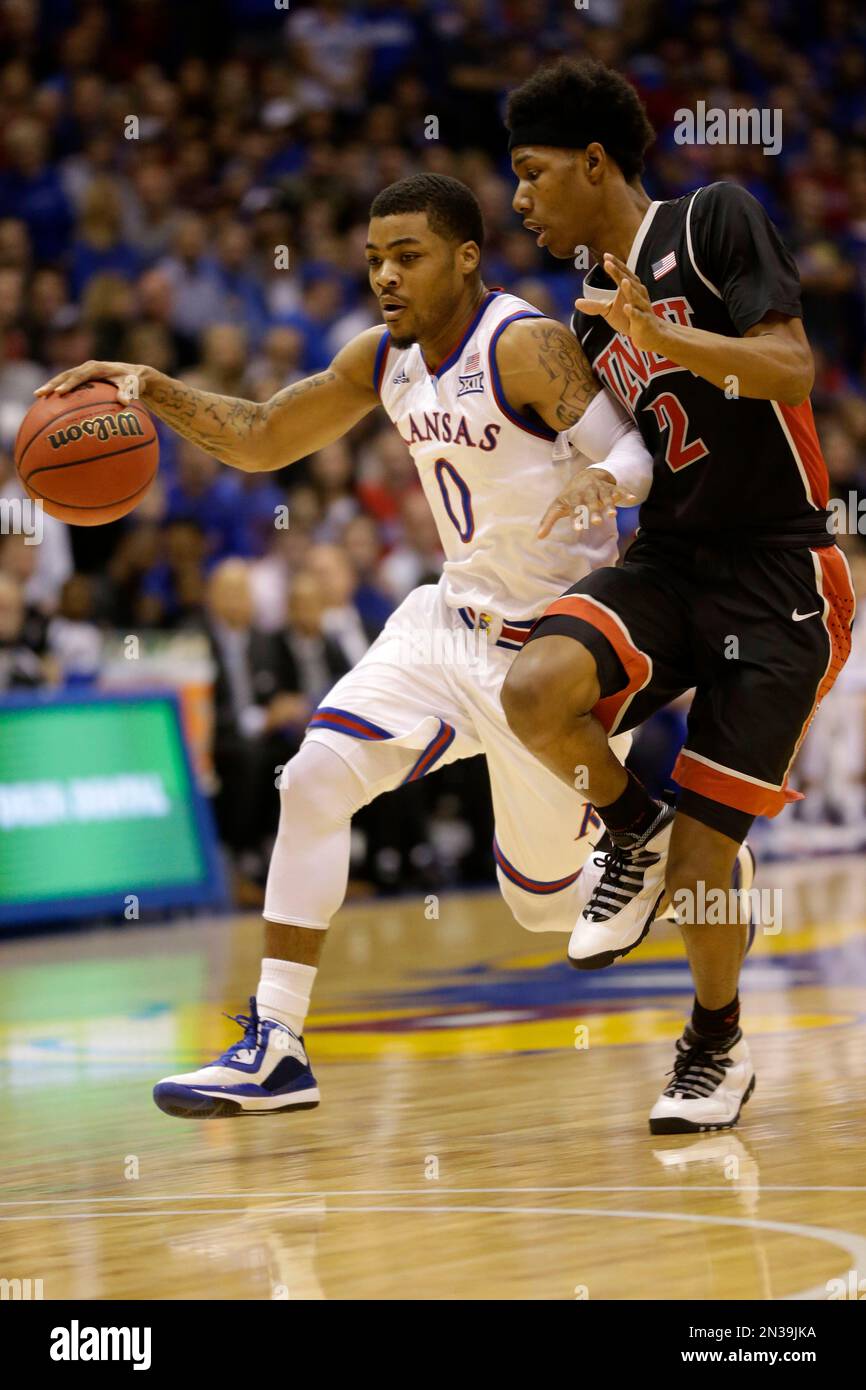 Kansas guard Frank Mason III (0) drives on UNLV guard Patrick McCaw (2 ...