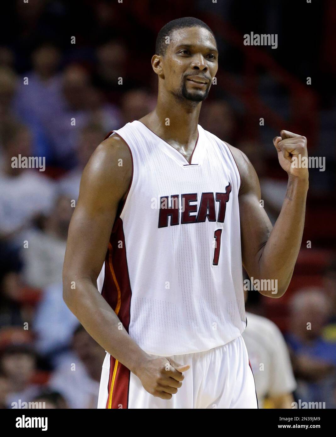 Miami Heat center Chris Bosh reacts after Dwyane Wade drew a foul during the second half of an ...